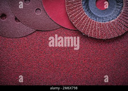 Emery paper abrasive discs flap grinding wheels on metallic background ...
