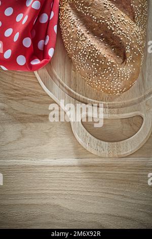 Bread carving board red polka-dot tablecloth on wooden background Stock ...