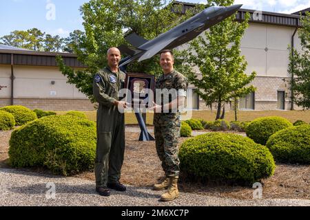 U.S. Marine Corps Col. Shawn M. Basco, right, passes ceremonial colors ...