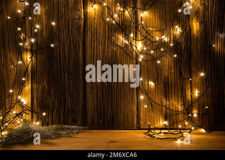 christmas lights and decorations on wooden background Stock Photo - Alamy