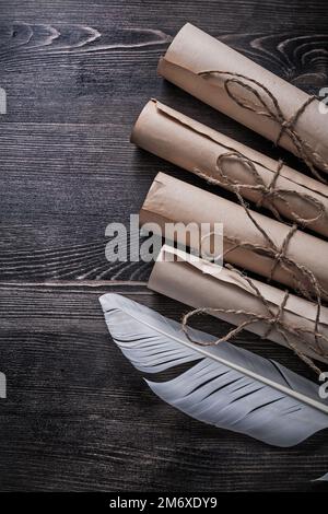 Pile of old paper rolls on crumpled packaging paper Stock Photo - Alamy