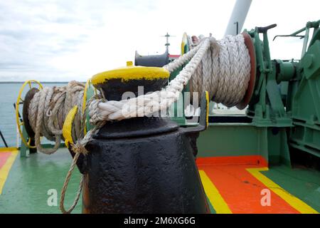 Mooring crane ropes on marine boat drums. Deck mooring mechanism at the ...