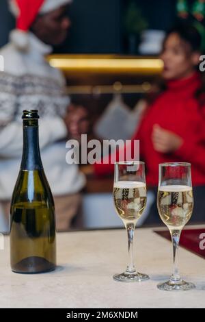 Knitted sweaters on shelf in room, closeup Stock Photo - Alamy