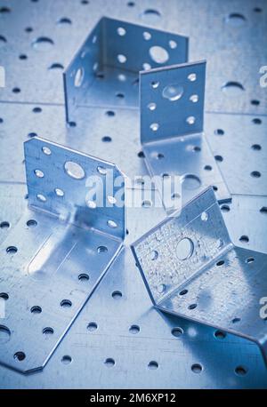 Stainless angle bar on perforated metallic sheet construction concept ...