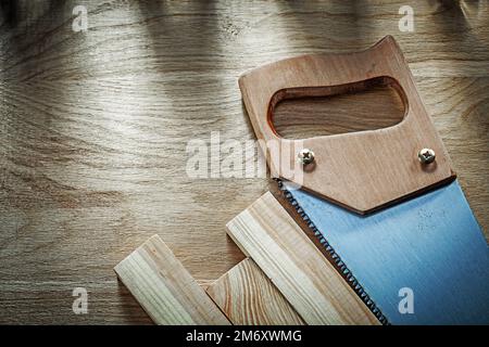 Sharp handsaw wooden planks on wood board construction concept Stock ...