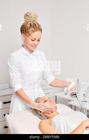 Cosmetologist makes facial gas liquid oxygen serum epidermal peeling ...