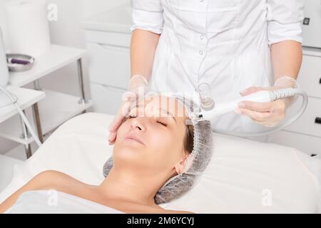 Cosmetologist makes facial gas liquid oxygen serum epidermal peeling ...