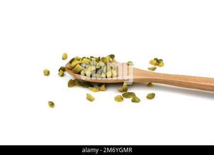 Chopped Pistachios in a wooden spoon isolated on white Background Stock ...