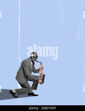 Floral melody. Emotional male musician playing saxophone with sticking ...