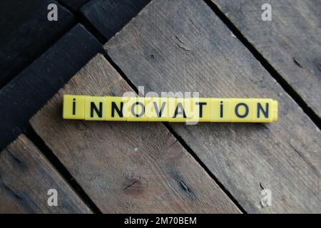 Innovation creative concept. Lettering from yellow cubes Stock Photo ...