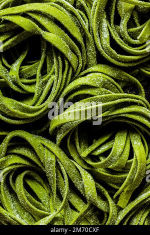 Green spinach tagliatelle pattern background Stock Photo - Alamy