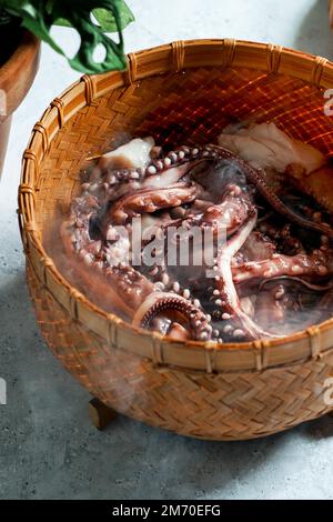 steamed octopus in a bamboo steamer, Asian style Stock Photo - Alamy