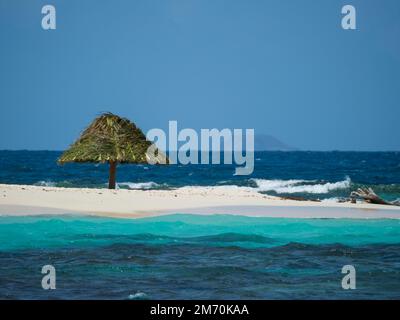 Umbrella Island, a reef islet near Petit Saint Vincent in the ...