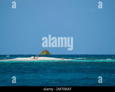 Umbrella Island, a reef islet near Petit Saint Vincent in the ...