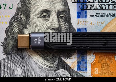 100 dollar banknote with black USB Type-C cord for design purpose Stock ...