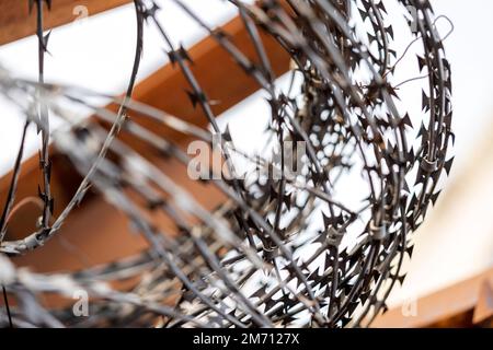 Barbed wire stretched over anti-tank hedgehogs. Fortified defense line ...