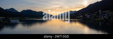 Evening atmosphere at sunset at Lake Weissensee, highest bathing lake ...