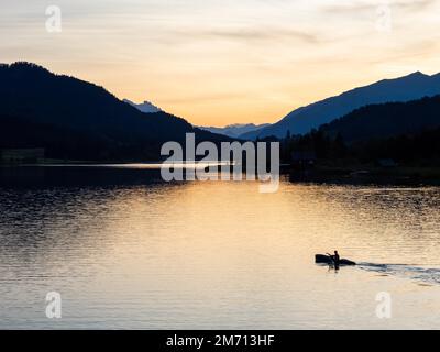 Evening atmosphere at sunset at Lake Weissensee, highest bathing lake ...