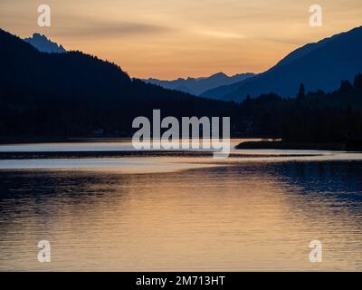 Evening atmosphere at sunset at Lake Weissensee, highest bathing lake ...