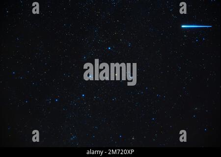 shooting star meteorite comet on the background of a blue dark starry ...