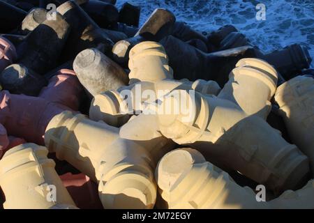 Colorful jetty stones on beach Stock Photo - Alamy