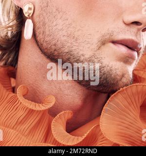 Young non binary man with beard wearing suit and tie looking to side ...