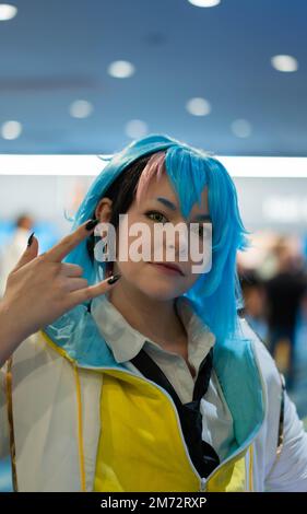 A vertical of a girl cosplaying as Vtuber streamer Millie Parfait at ...