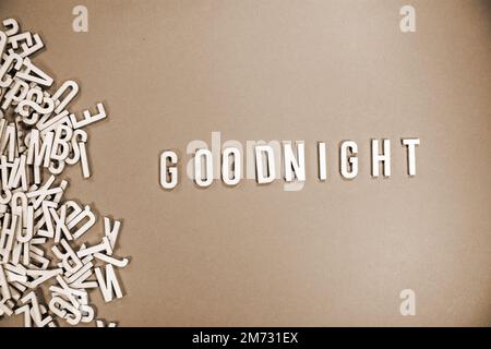 GOODNIGHT in wooden English language capital letters spilling from a ...