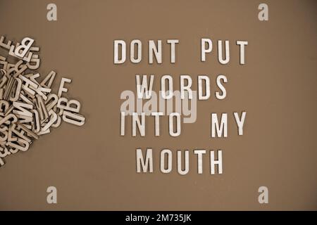 WORDS INTO MY MOUTH in wooden English words language capital letters ...