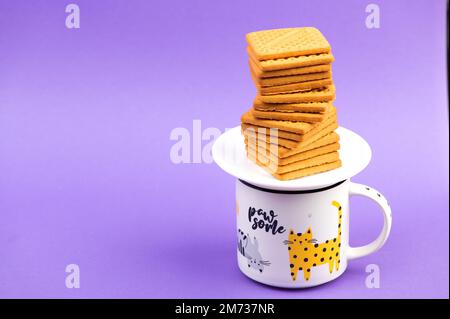 Cookies and cup of coffee. Stacks of tasty cookies on the white plate ...