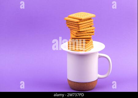 Cookies and cup of coffee. Stacks of tasty cookies on the white plate ...