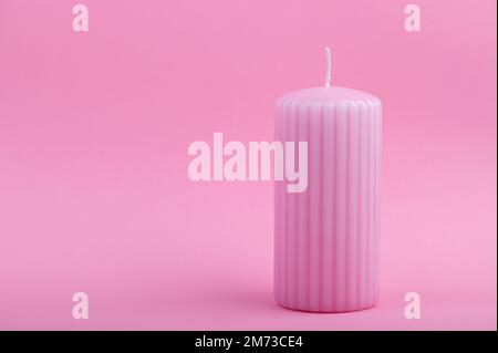 pastel colors pink candle with beautiful neutral color bow on pink ...