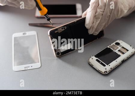 Technician prepairing to repair and replace new screen broken and ...