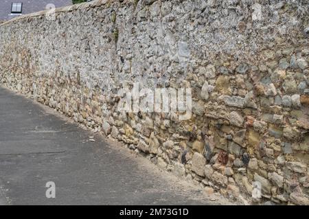 Roadside sandstone wall in southern Scotland eroded because of traffic ...
