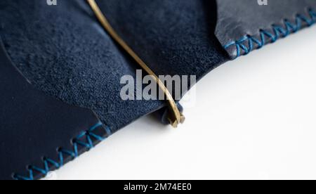 Blue men's business genuine leather money clip on a white surface ...