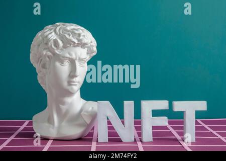 NFT (Non-Fungible token) and antique sculpture in neon light. Concept ...