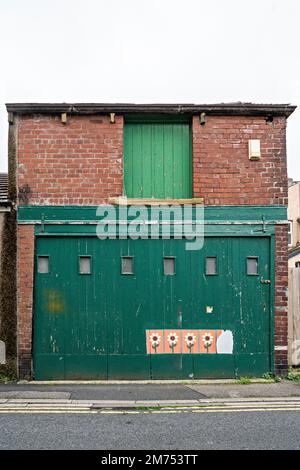 Two-storey garage workshop in town Stock Photo - Alamy