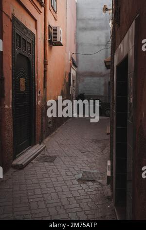Narrow back streets of Marraekch in Morocco. Portrait orientation ...