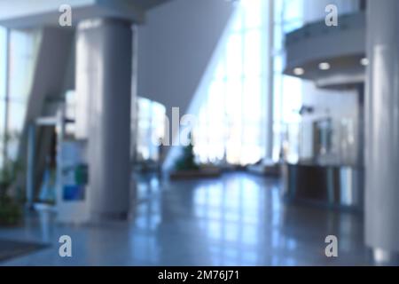 blurry image of a lobby with a cozy interior in a modern office ...