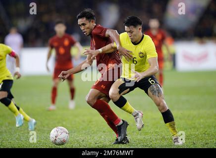 Teerasil Dangda of Thailand (C) and Dominic Tan Jun Jin (L), Brendan ...