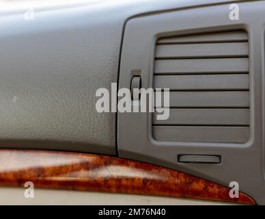 Air vent grill in a car. Air conditioner grid and control panel buttons ...