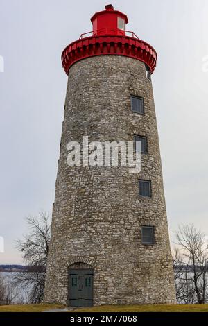 Old lighthouse - stone brick building with red roof windows and door ...