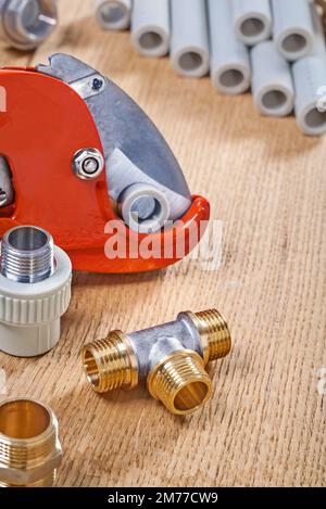 Plumbers plumbing pipes on wooden work table Stock Photo - Alamy
