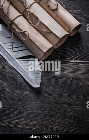 Rolled vintage documents with string on wicker wooden matting Stock ...