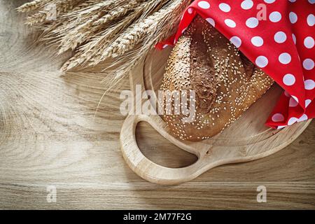 Bread rye ears red polka-dot napkin quill vintage scroll on wooden ...