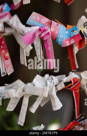 A fortune telling slip at Tomioka Shrine closeup Stock Photo - Alamy