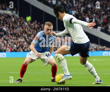L-R Zak Swanson of Portsmouth and Tottenham Hotspur's Heung-Min Son and ...