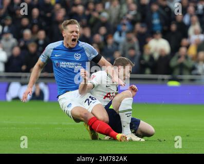 L-R Michael Morrison of Portsmouth and Tottenham Hotspur's Oliver Skipp ...