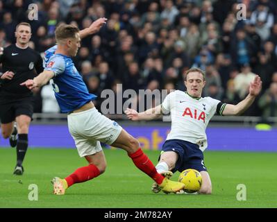 L-R Michael Morrison of Portsmouth and Tottenham Hotspur's Oliver Skipp ...