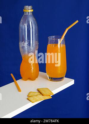 A Cold Bronx Cocktail drink and Cracker Biscuit isolated on blue ...
